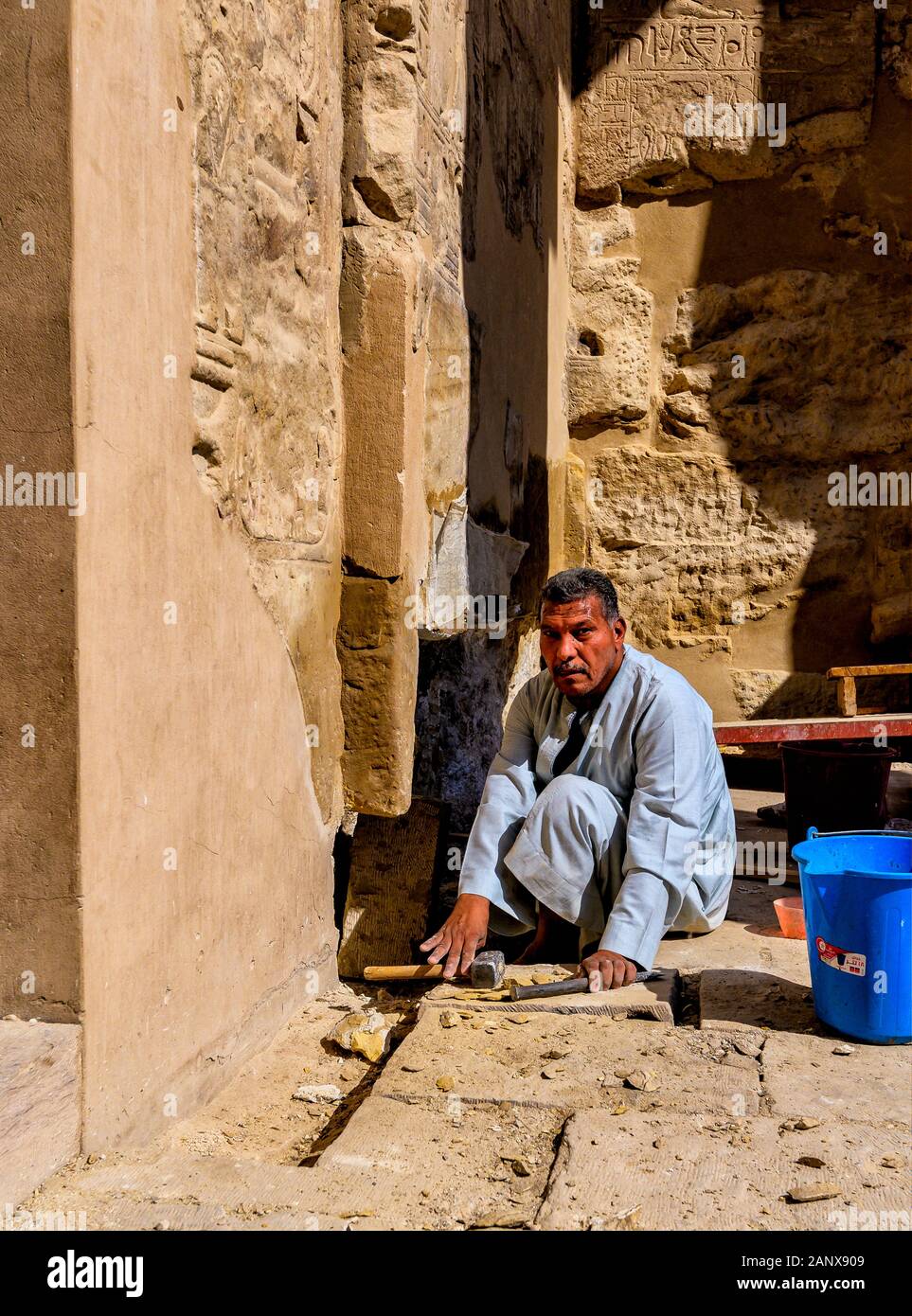 Modern Day Stone Mason working on restoration work at Sety I Temple ...