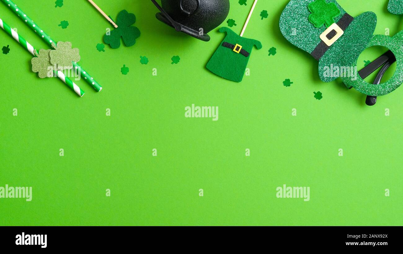 St Patrick's day top frame border of shamrock four leaf clover, pot of ...