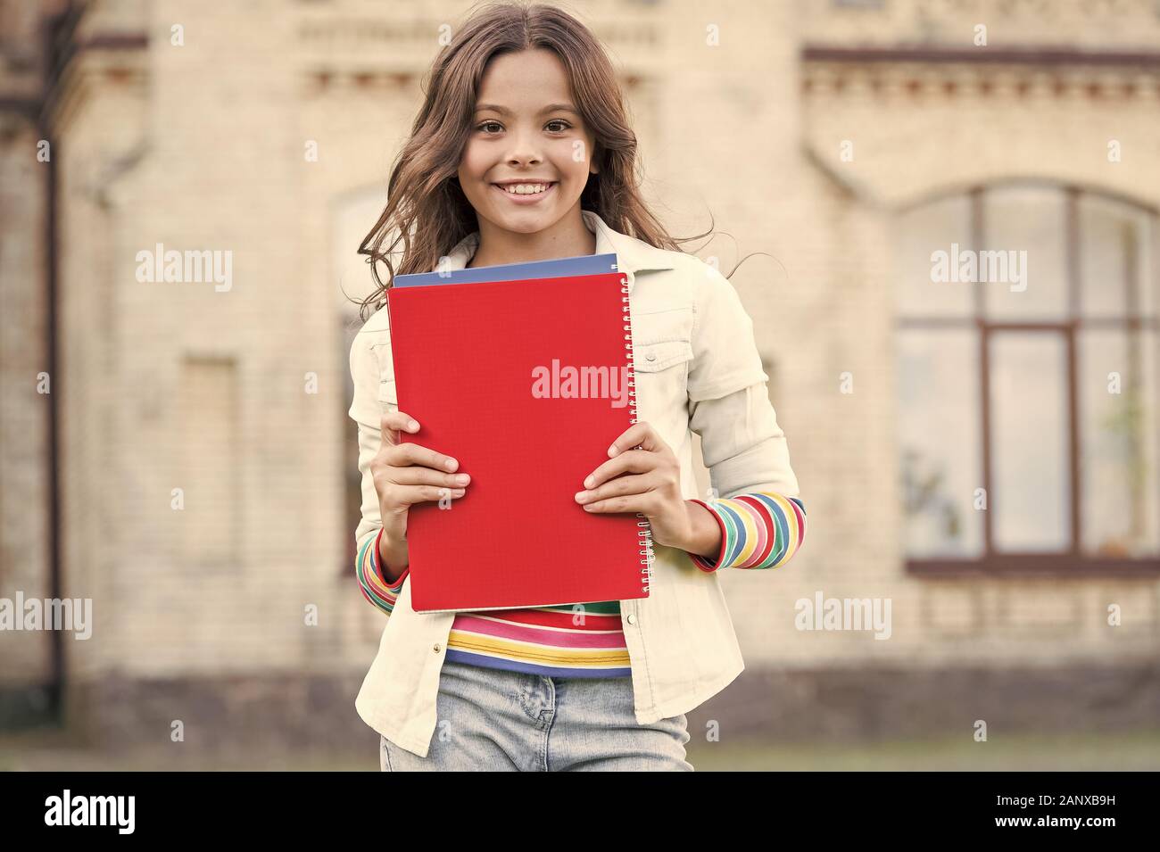 Read more books. Happy small child going to library to take books ...