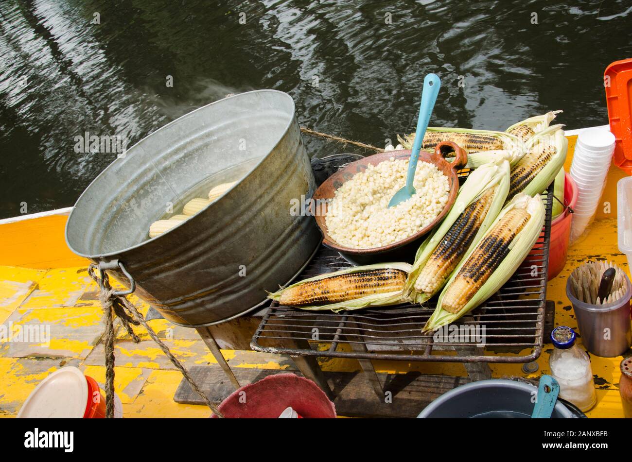 Esquites and elotes, traditional Mexican corn-based meals, in a ...