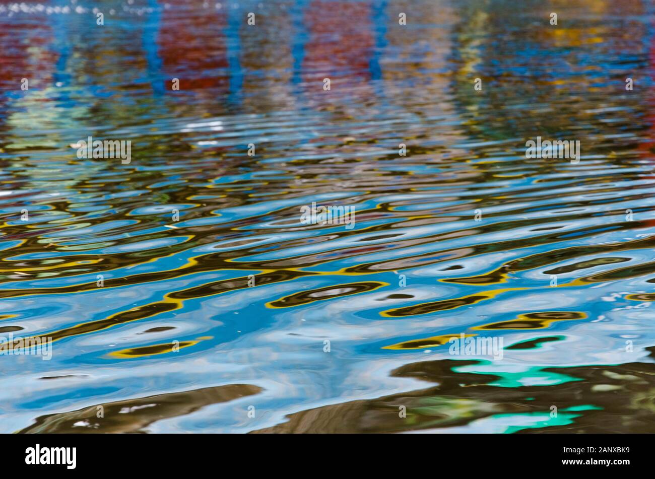 Colorful reflection on moving water, in Xochimilco, Mexico Stock Photo ...
