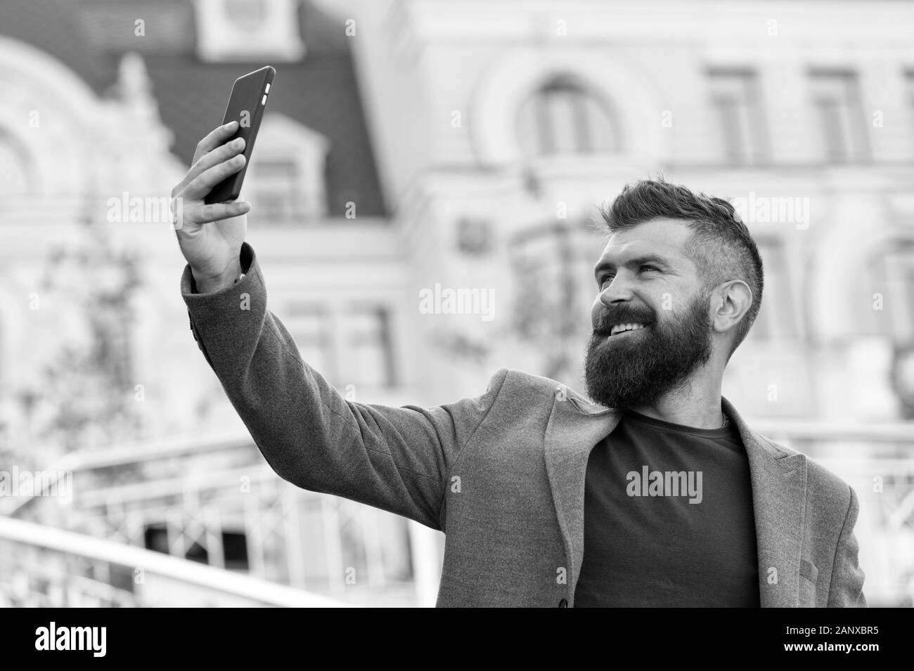 Smiling guy online video Black and White Stock Photos & Images - Alamy