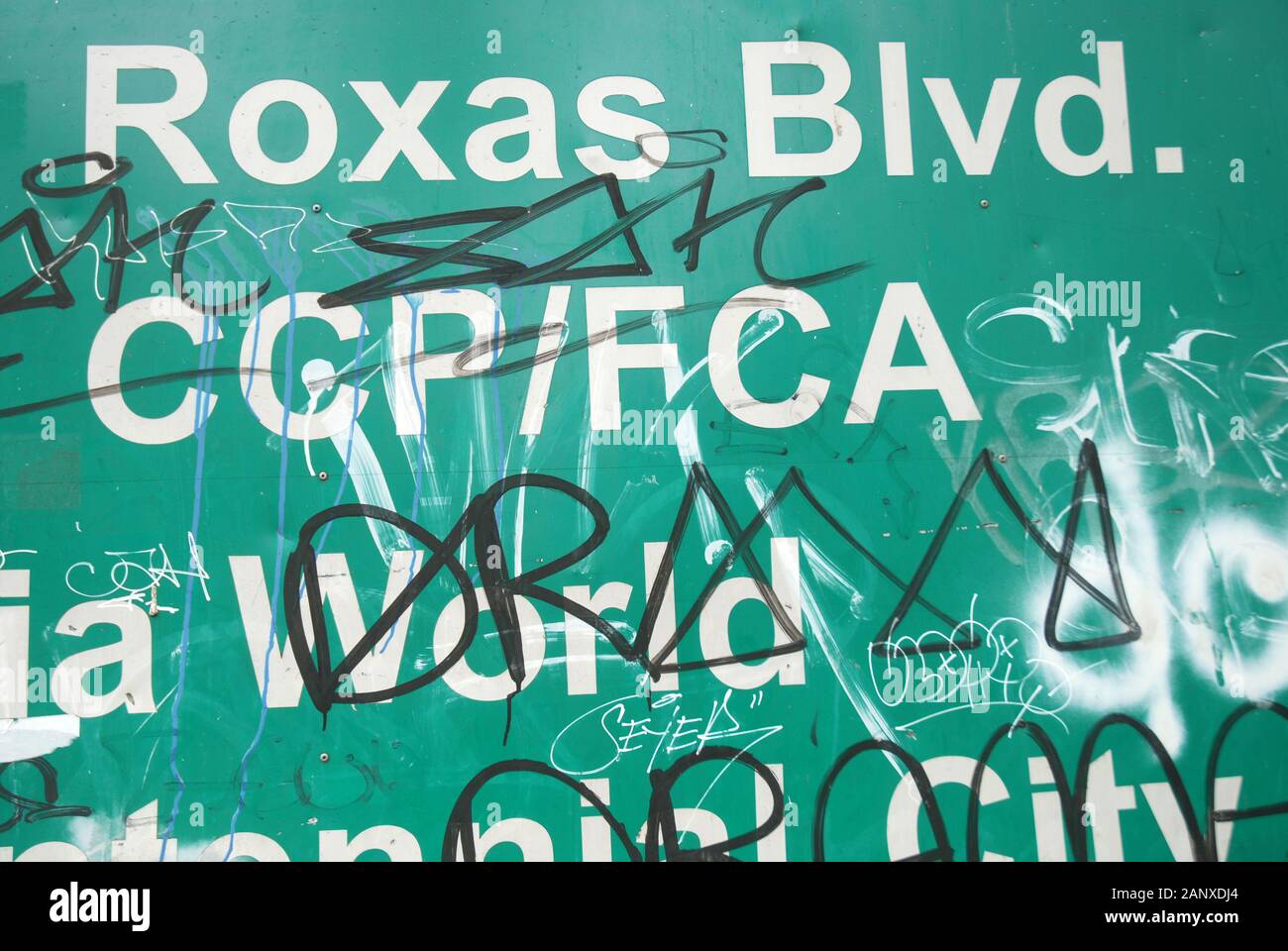 Roxas Blvd. Road Sign with grafitti, Manila, Philippines Stock Photo ...
