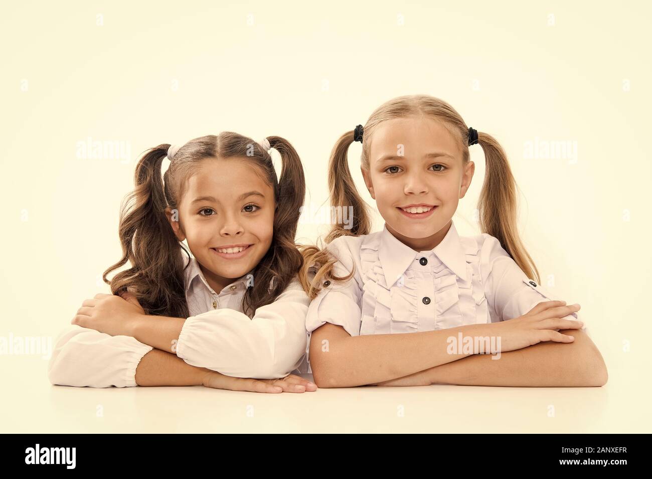 Lesson where learning begins. Cute school children sitting at school ...