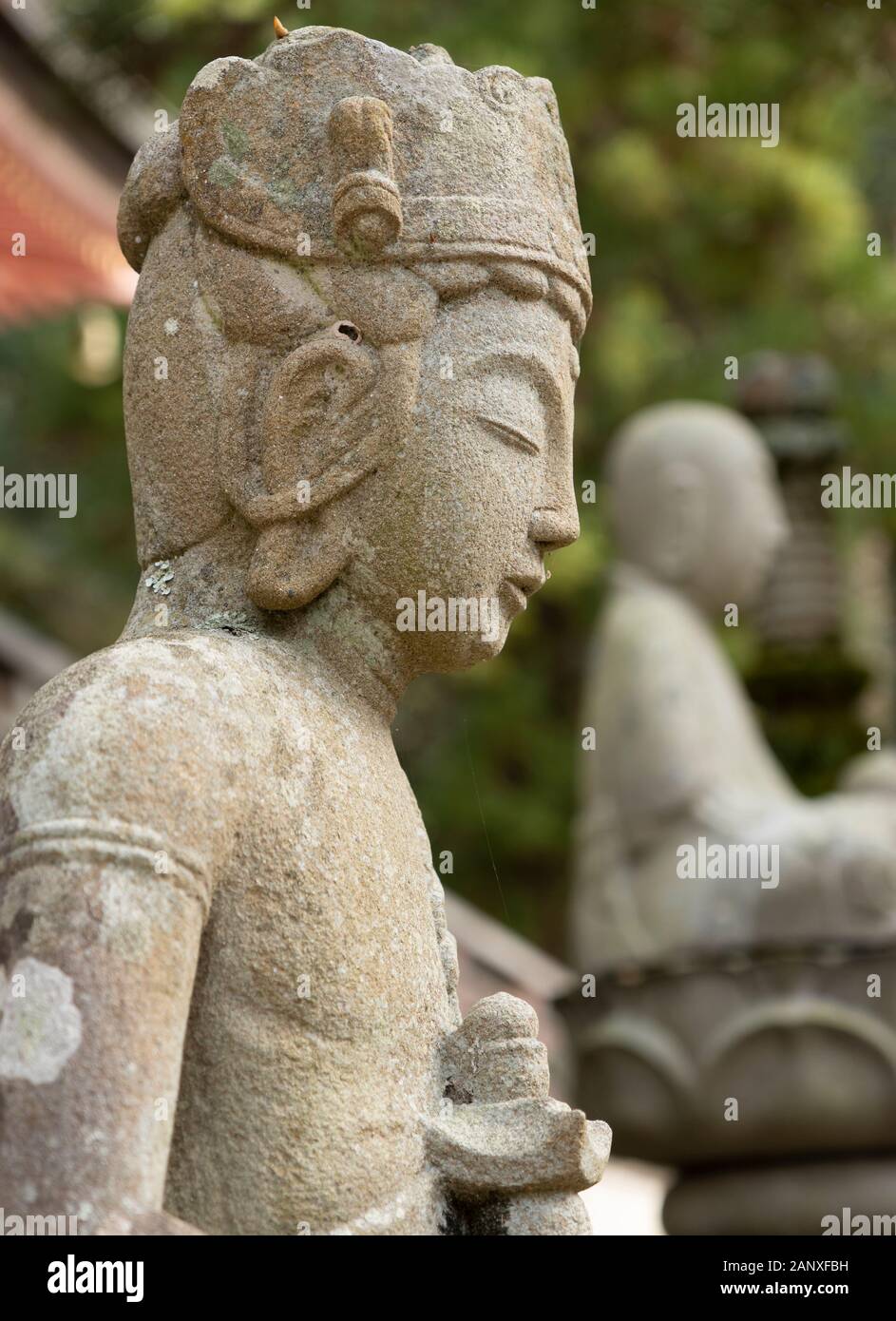 A stone statue at Yakuri-ji, the 85th Buddhist temple on the Shikoku ...
