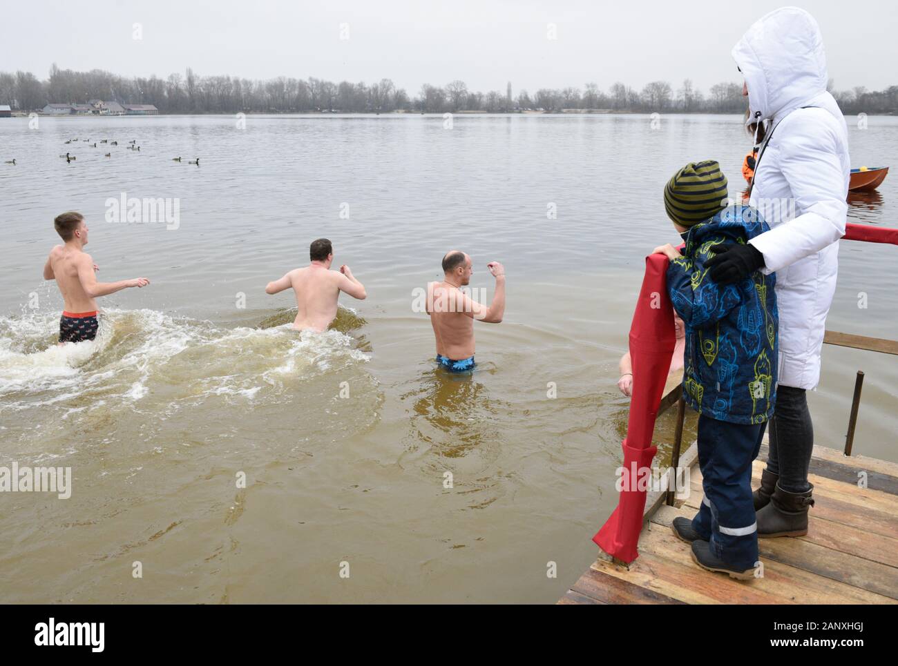 People take a dip in the Dnieper River during the celebrations of ...