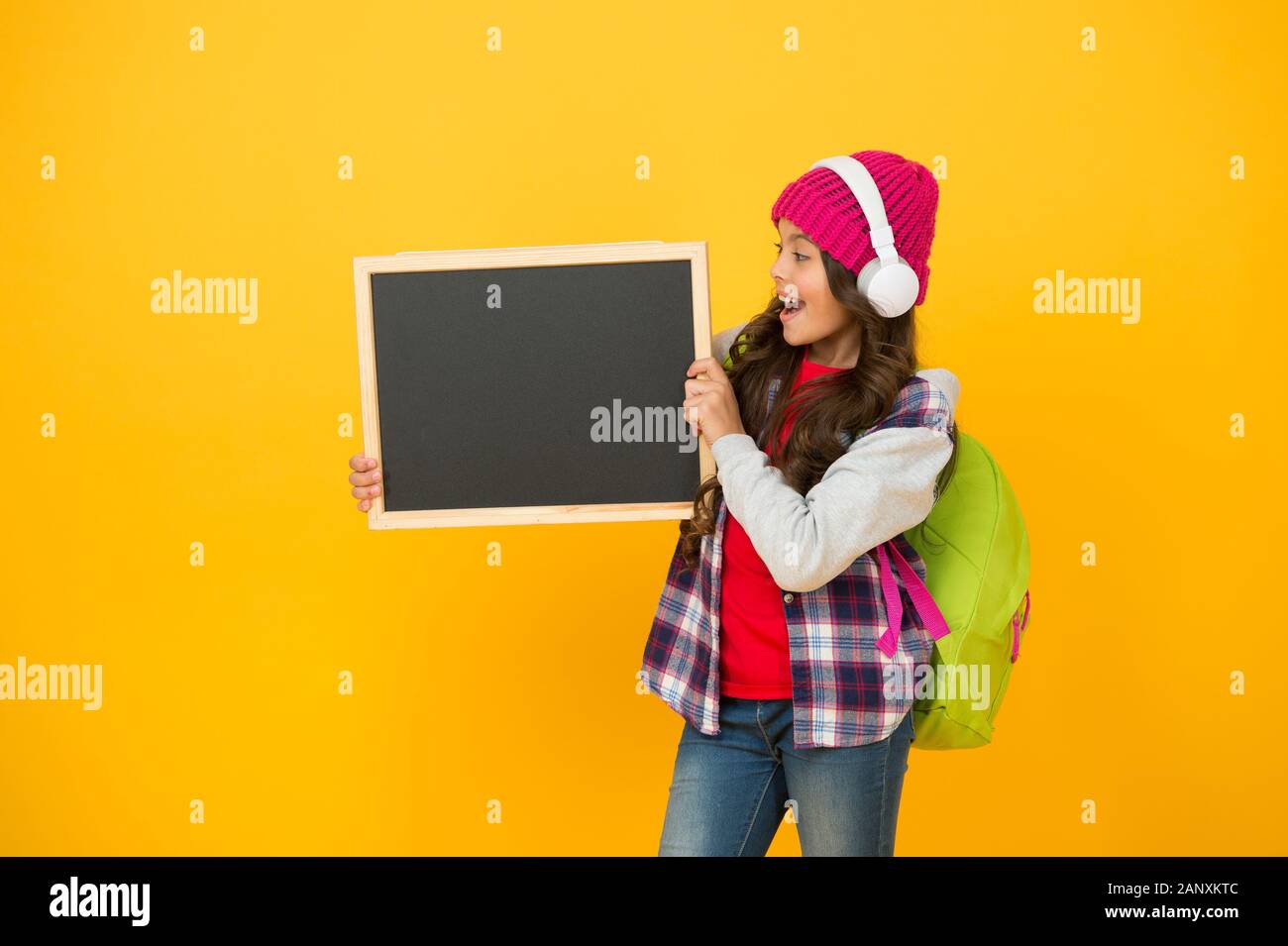 Creative school. Happy child hold school blackboard. Little girl back ...