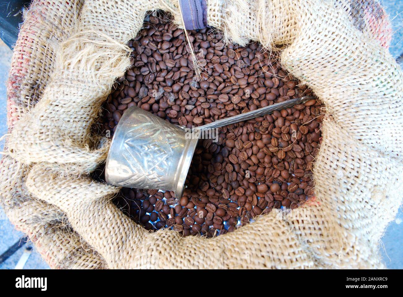 a sack of Arabica core Coffee. copper coffee pot Stock Photo - Alamy