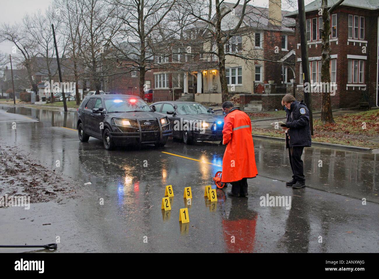 Crime scene investigators at the scene of a shooting homicide in ...