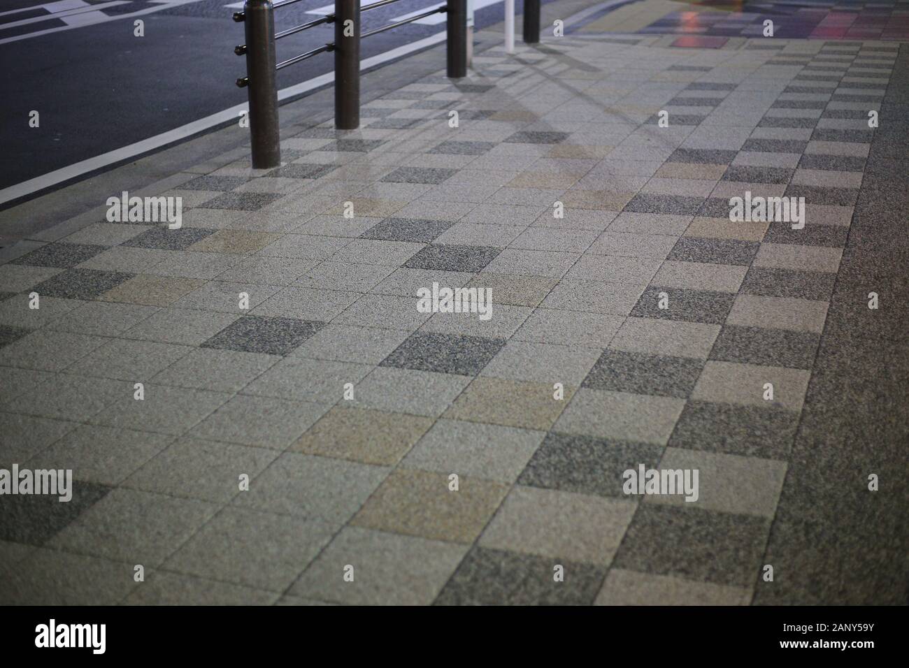 pedestrian pavement design with random dot of square light brown and ...