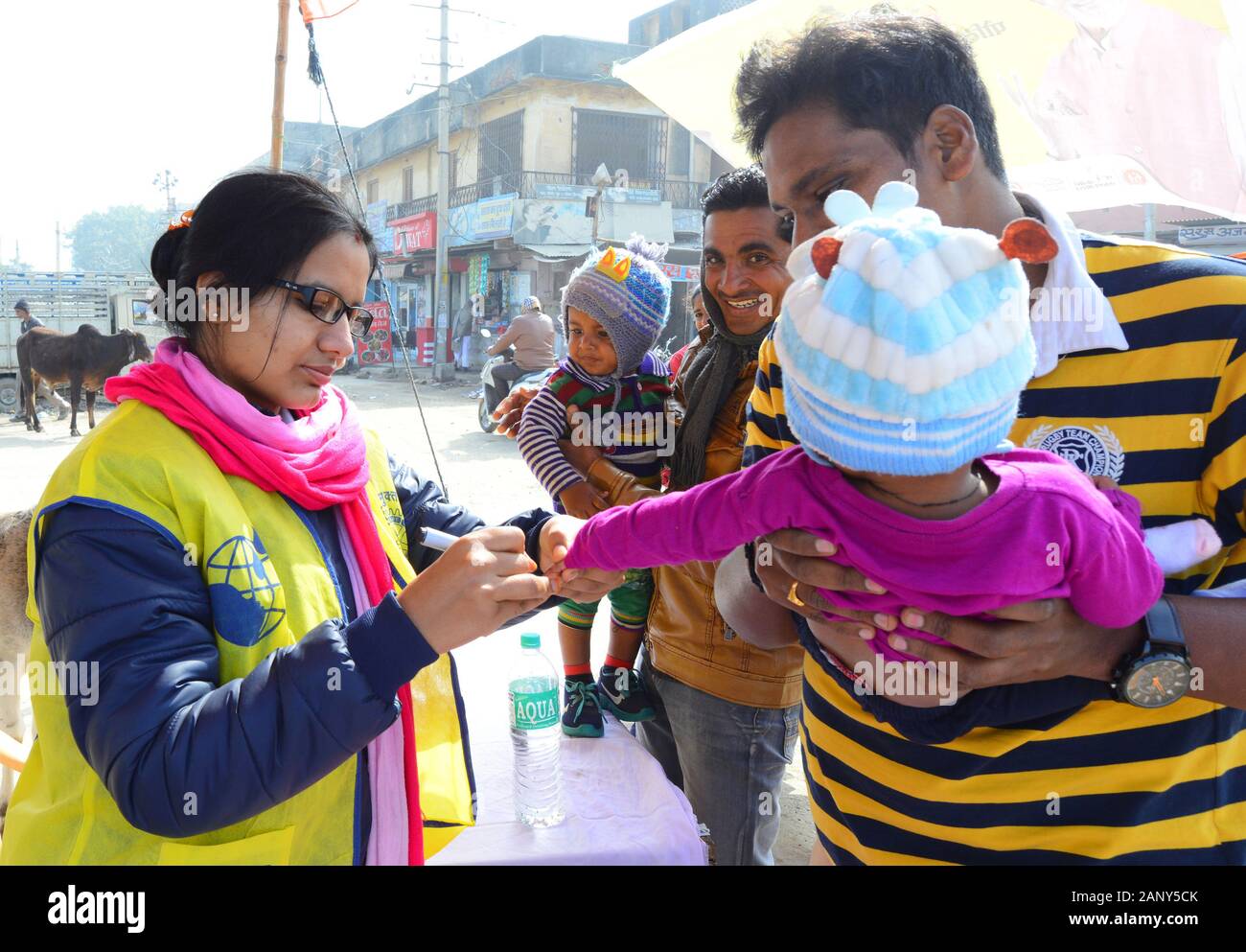 India. 19th Jan, 2020. An ANM worker marks the finger of a child after ...