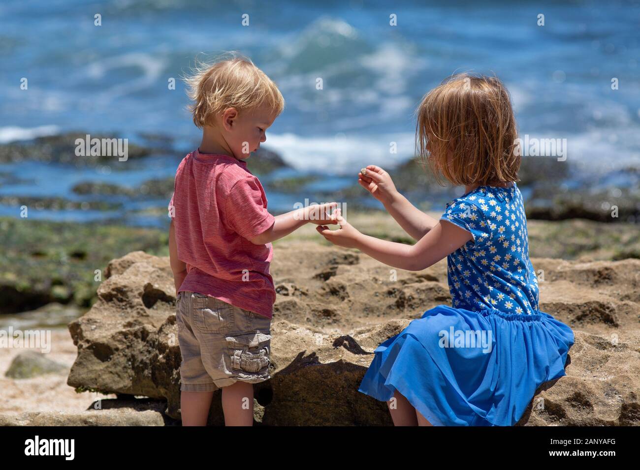 Child giving something back hi-res stock photography and images - Alamy