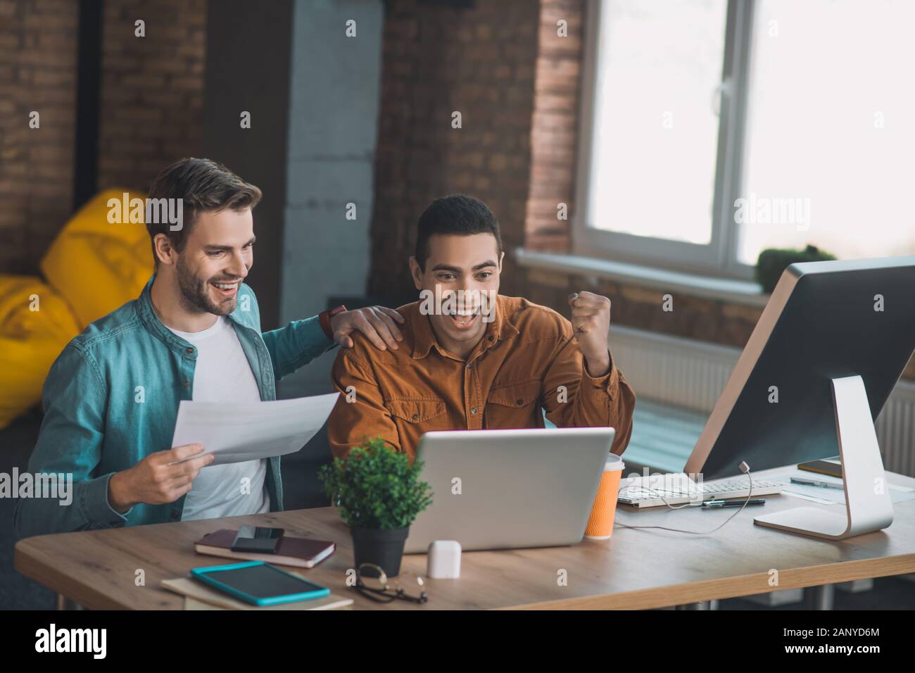 Joyful work partners showing hi-res stock photography and images - Alamy