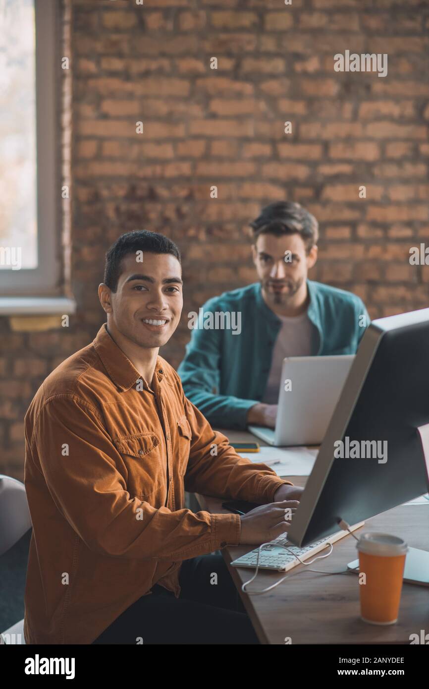 Idea positive delighted colleagues hi-res stock photography and images ...