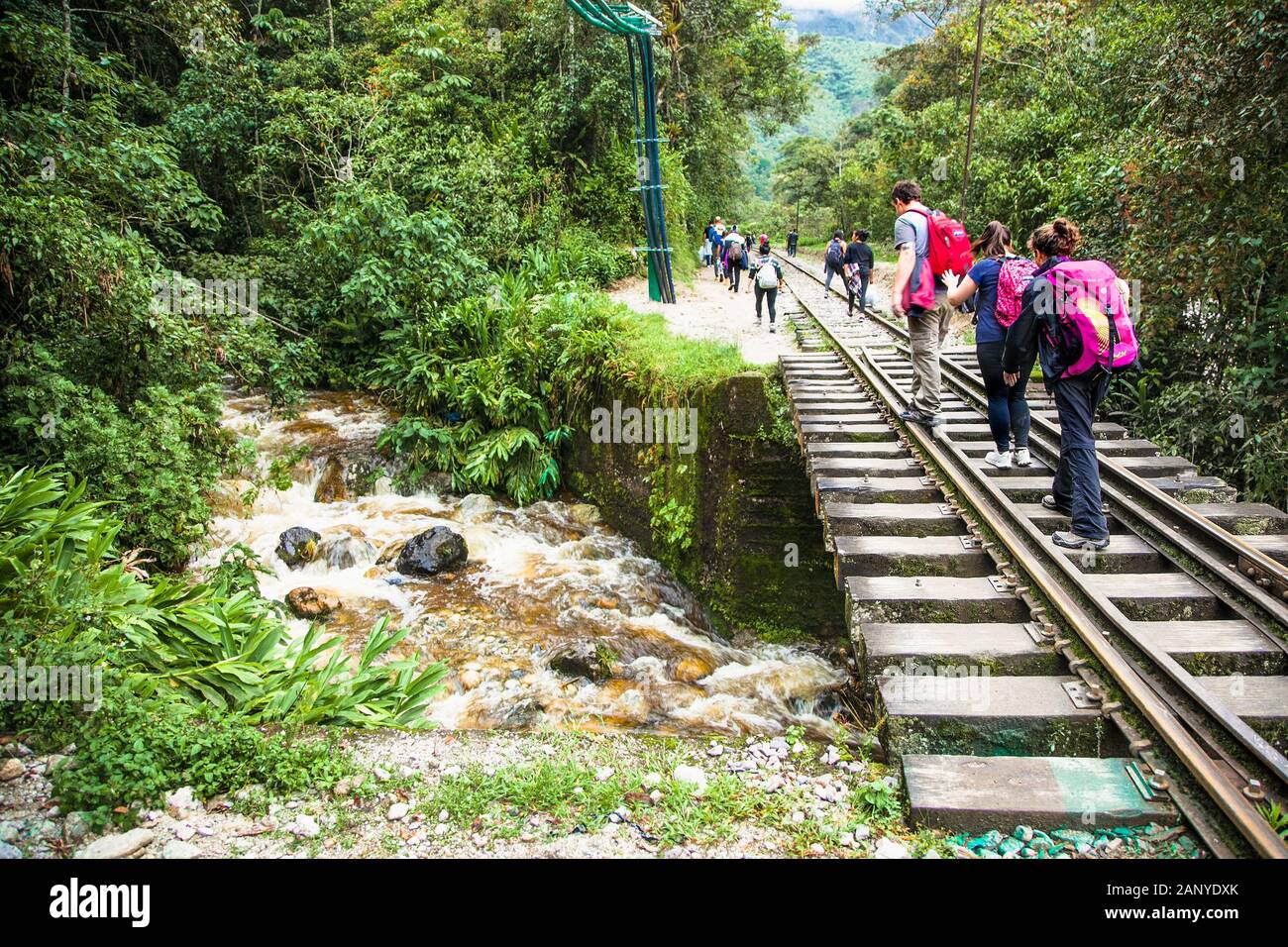 Machu Picchu Pueblo, Peru - Jan 8, 2019: People cross the railway ...
