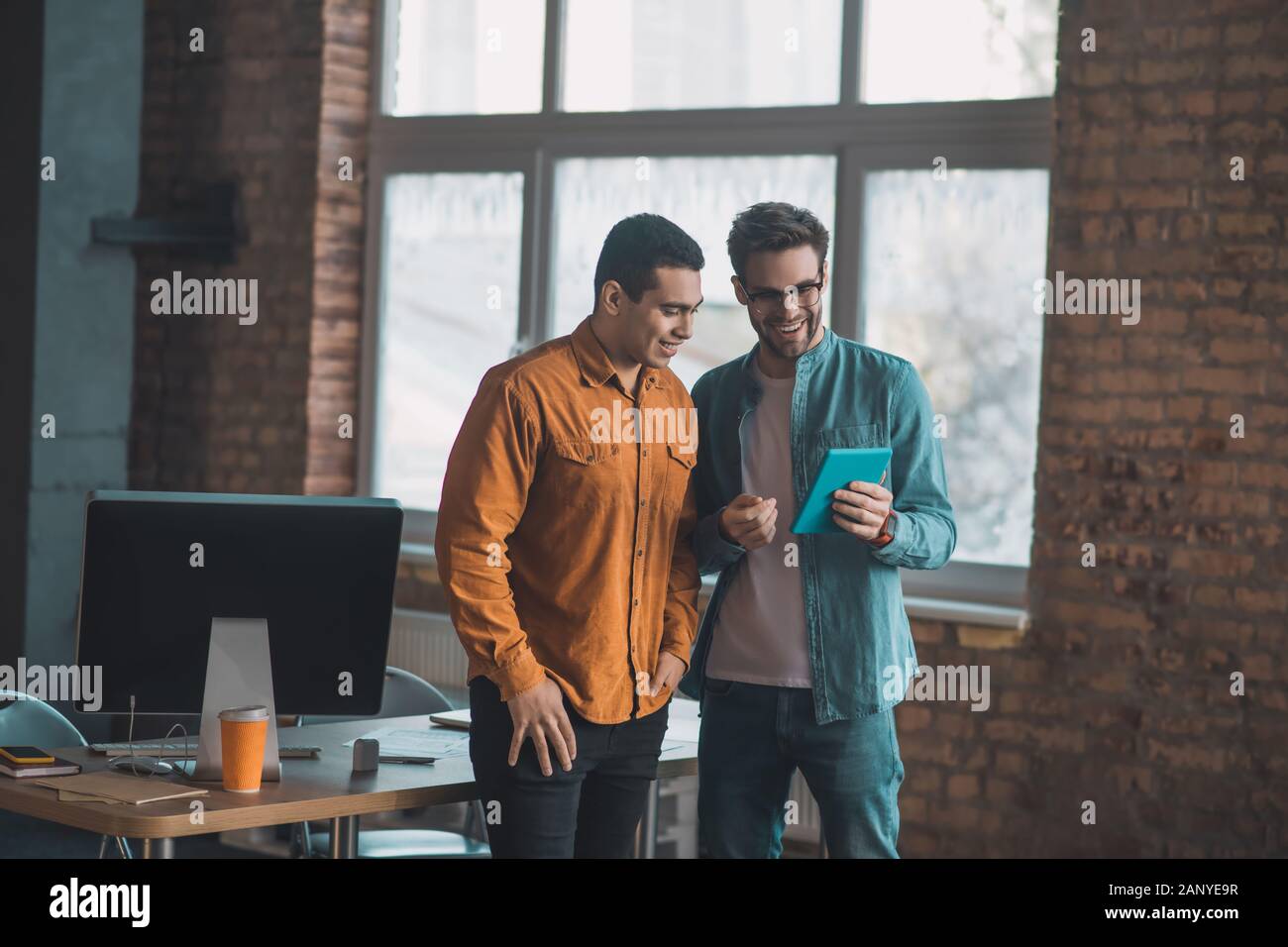 Nice joyful man speaking to his friend Stock Photo - Alamy