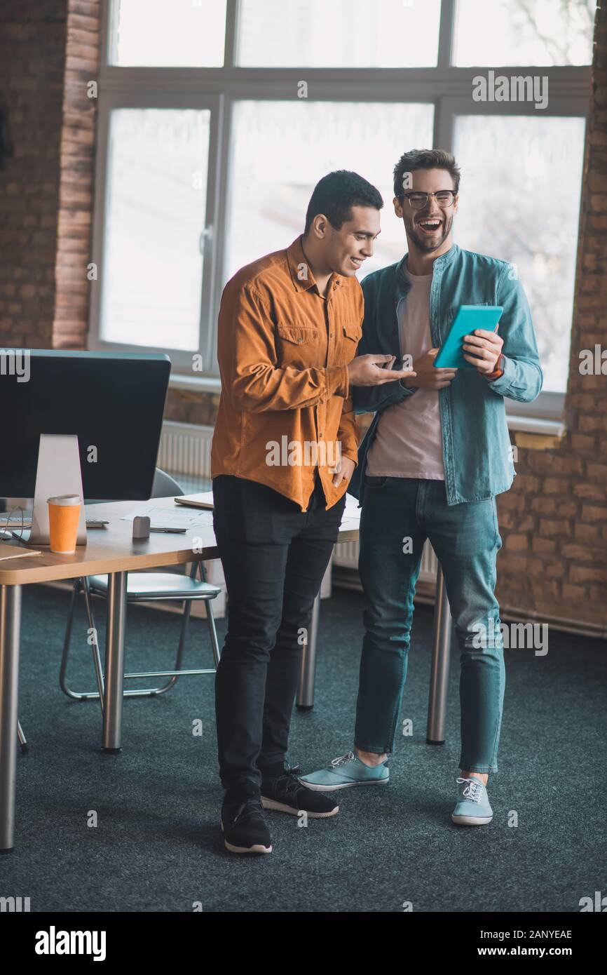 Nice happy men talking to each other Stock Photo - Alamy