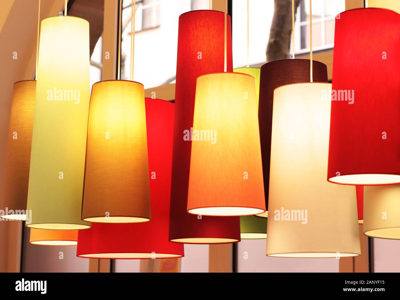 group of multi colored lamps hanging side by side Stock Photo - Alamy