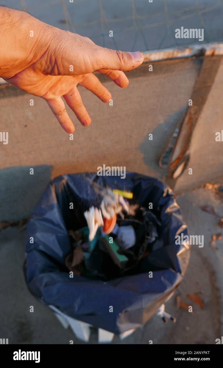 throw the garbage in dustbin Stock Photo - Alamy