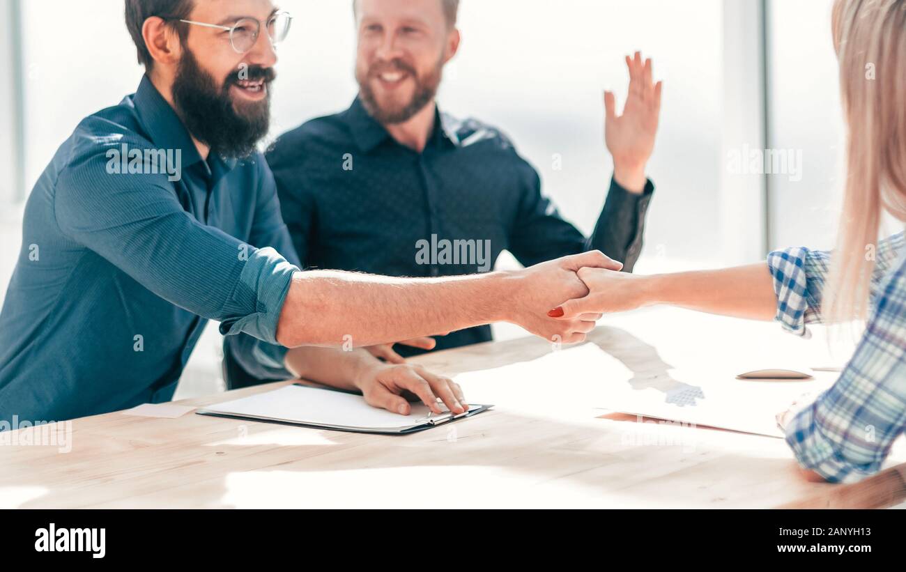 Interviewer handshaking the applicant hi-res stock photography and ...
