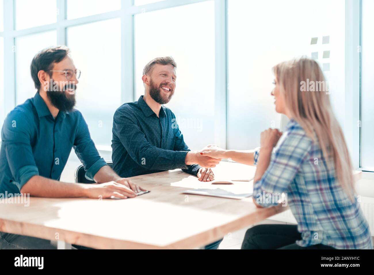 Interviewer handshaking the applicant hi-res stock photography and ...