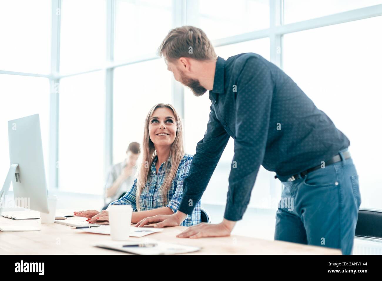 Employees discussing in office typing hi-res stock photography and ...
