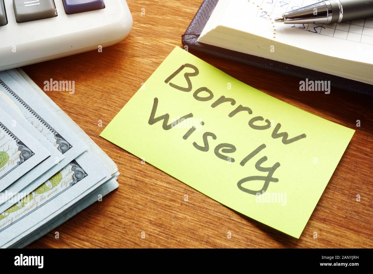 Borrow Wisely sign and money. Choose loan concept Stock Photo - Alamy