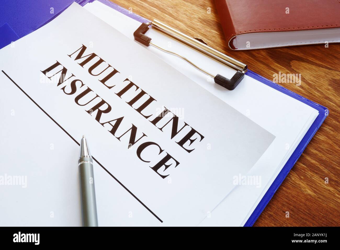 Multiline Insurance agreement and pile of papers Stock Photo - Alamy