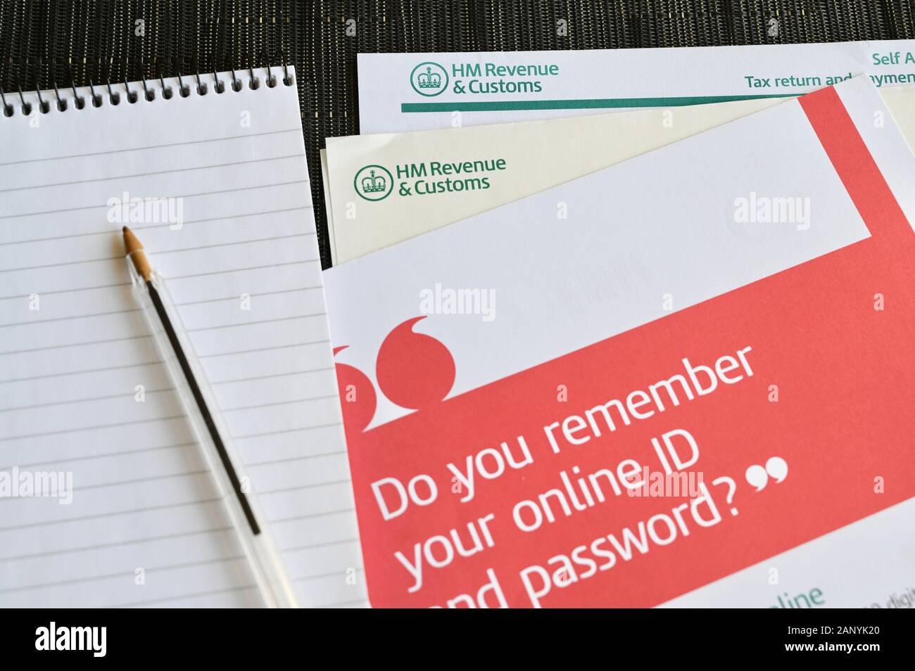 HM Revenue & Customs. Preparing a tax return. Notepad, pen and tax ...