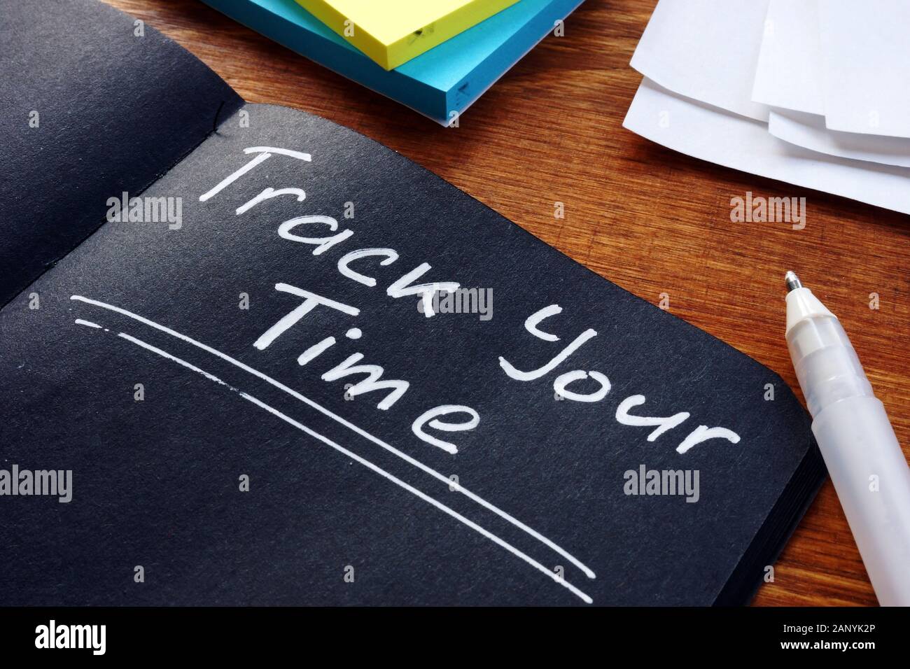 Time management concept. Track Your Time phrase handwritten on the ...