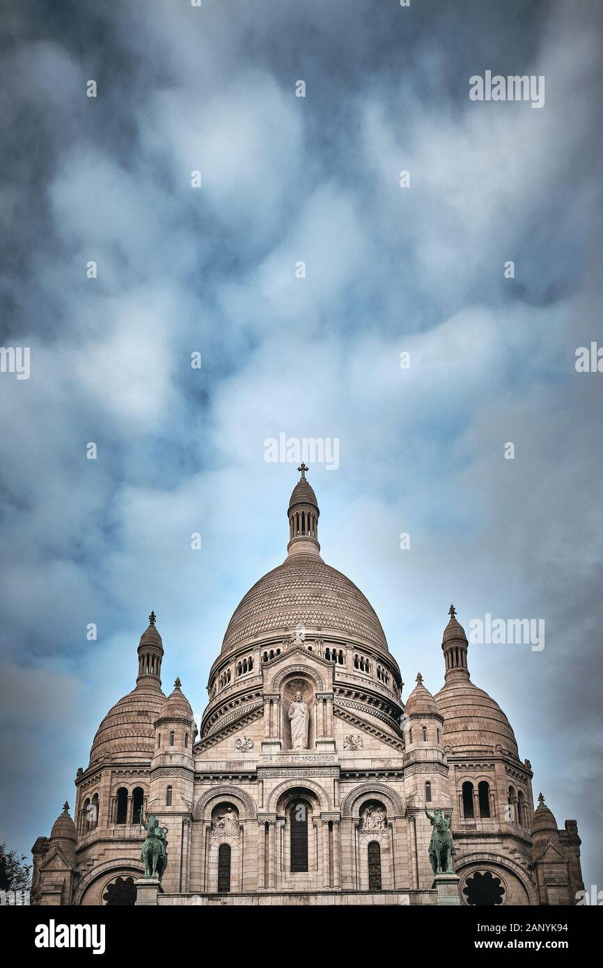 Vertical low angle shot of the Basilica of the Sacred Heart of Paris in ...