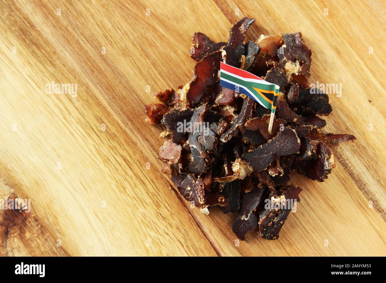 Flag of South Africa on traditional biltong snack on a wooden surface ...