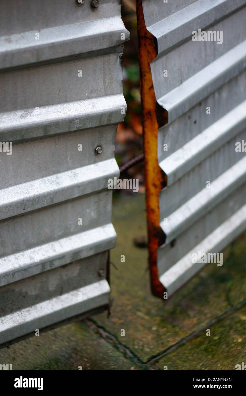 Vertical closeup low angle shot of a slightly opened metal door Stock ...
