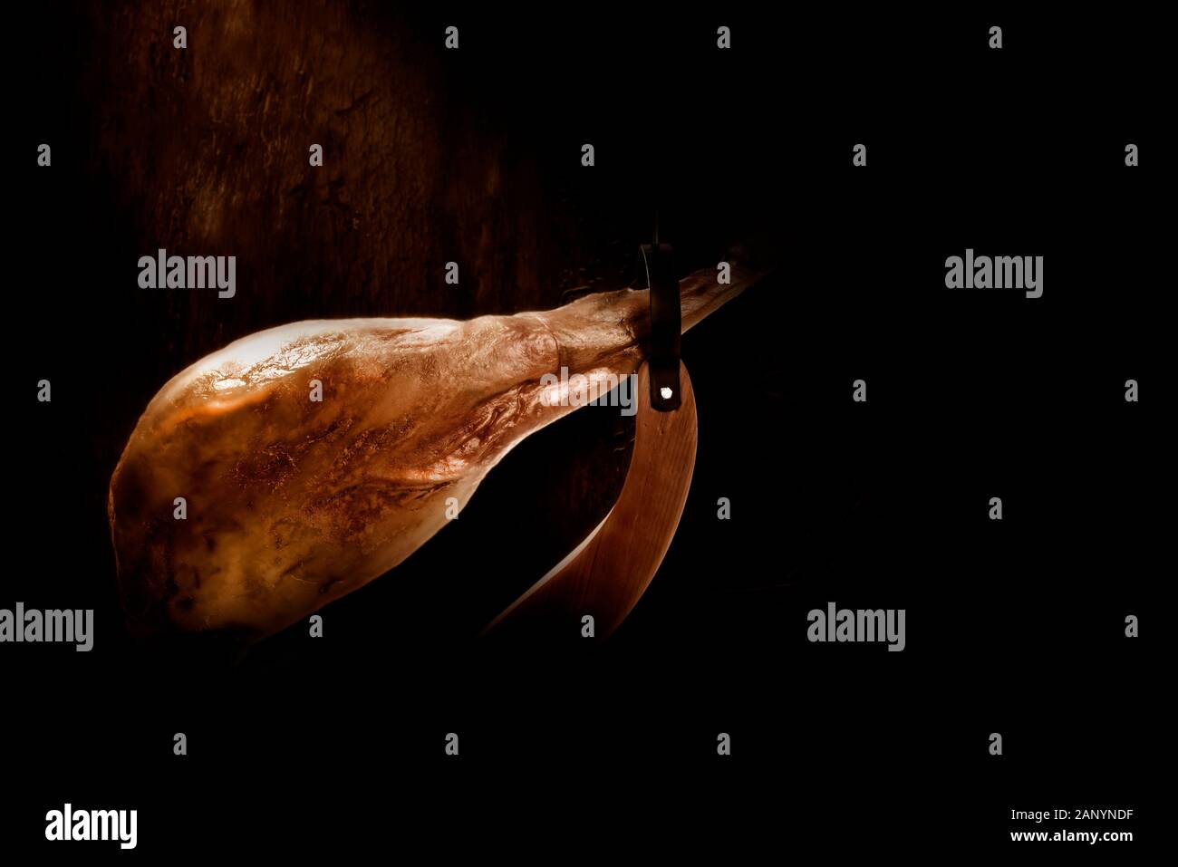 Spanish whole Iberian ham leg extra quality in dark background Stock ...