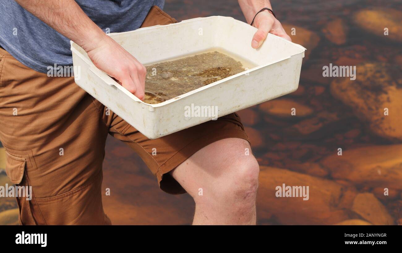 Bucket filled with water and a hi-res stock photography and images - Alamy
