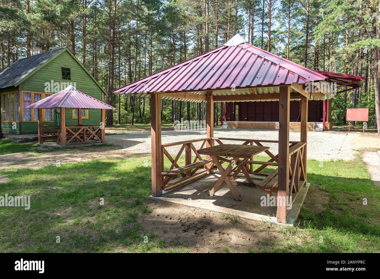 wooden camping arbors with all conviniences in a pine forest Stock ...