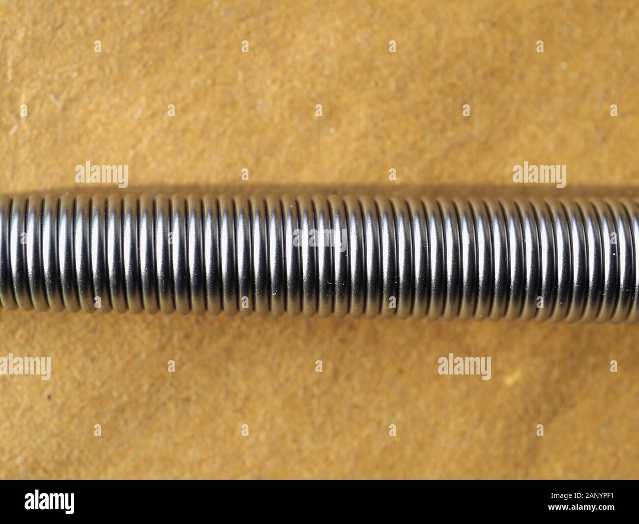grey steel spring pipe with copy space Stock Photo - Alamy