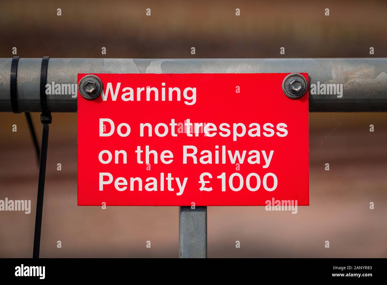 Sign: Warning, Do niot trespass on the railway, penalty 1000GPB, seen ...