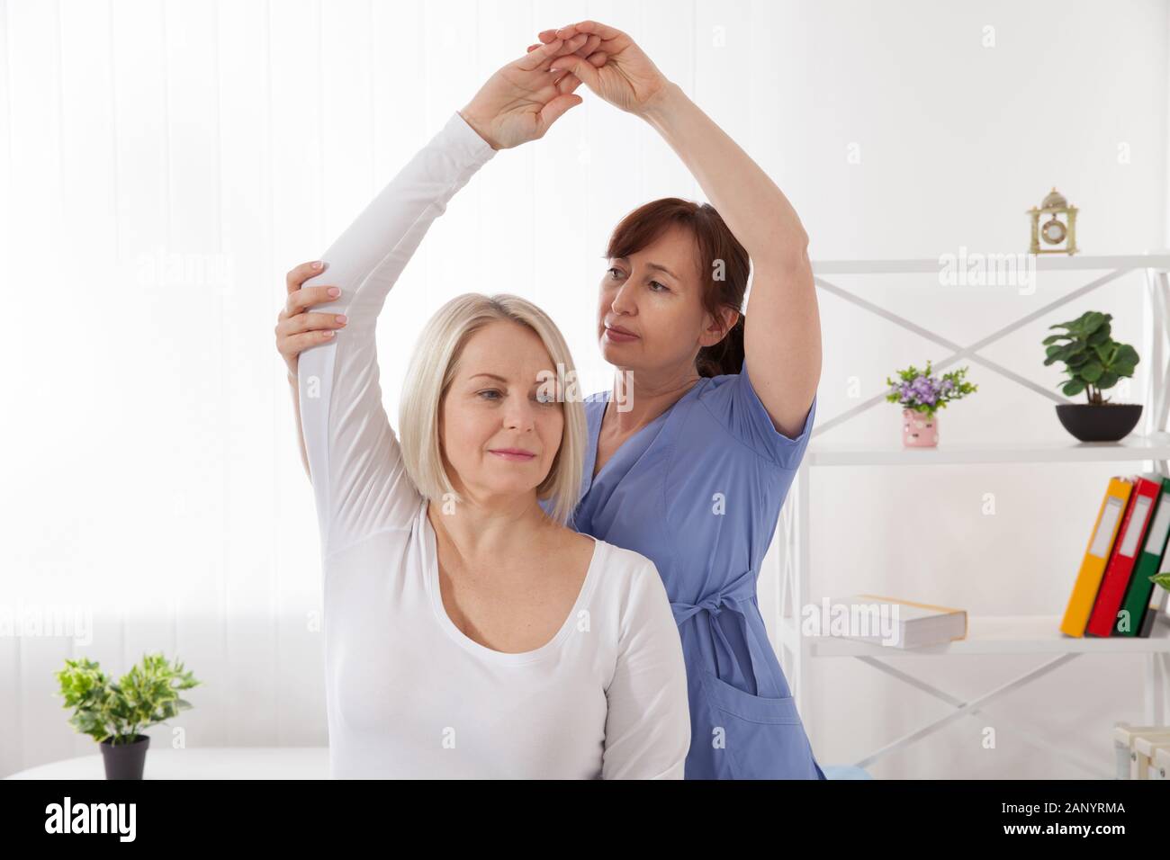 Picture of middle aged woman during rehabilitation in professional ...