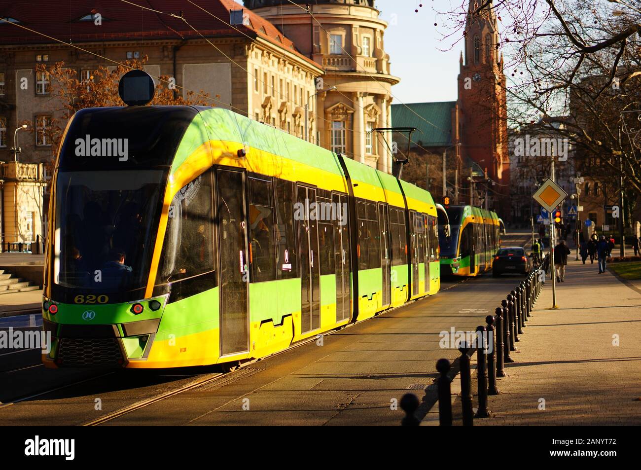 POZNAN, POLAND - Jan 16, 2020: Green trams on a road in the Fredry ...
