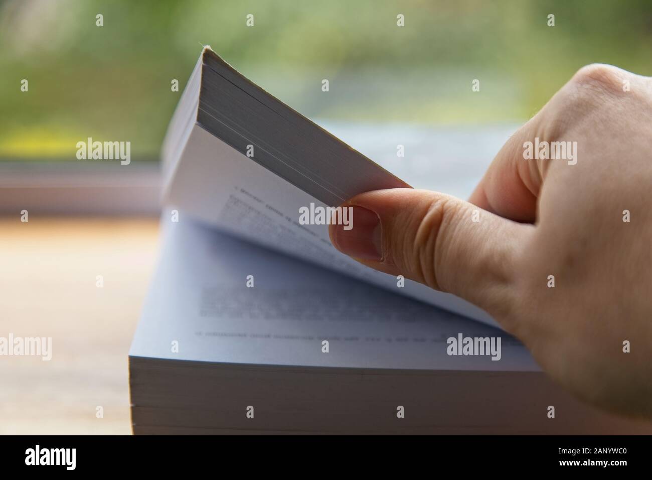 Hand opening book hi-res stock photography and images - Alamy