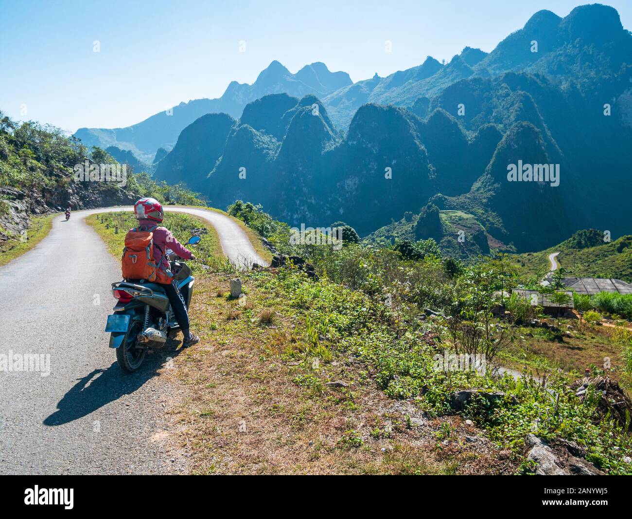 One person riding bike on Ha Giang motorbike loop, famous travel destination bikers easy riders ...