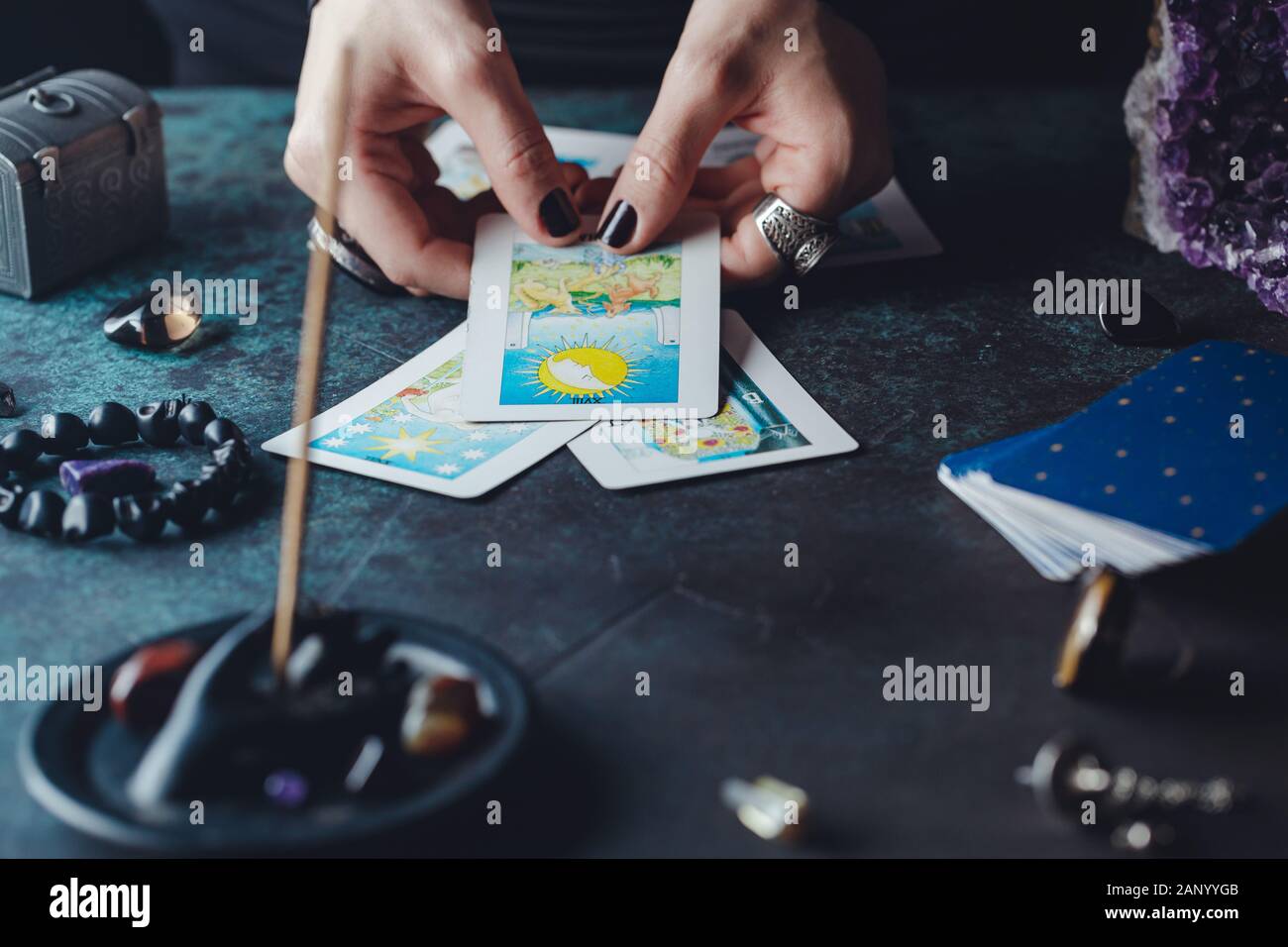 Witch predicts and reads the future through the use of Tarot cards ...