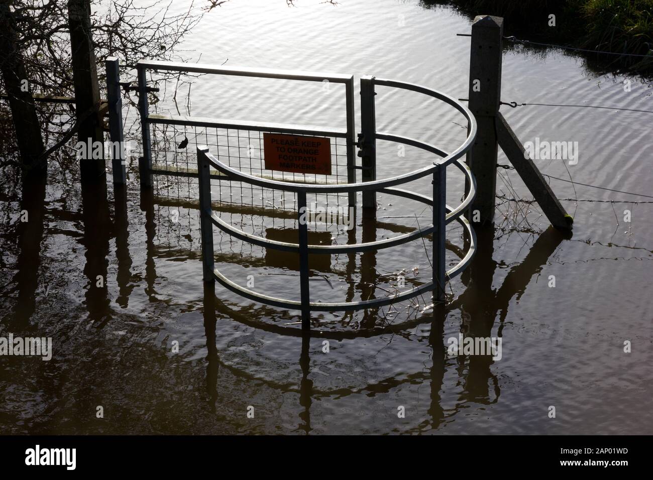 Flooded footpath gate Stock Photo - Alamy