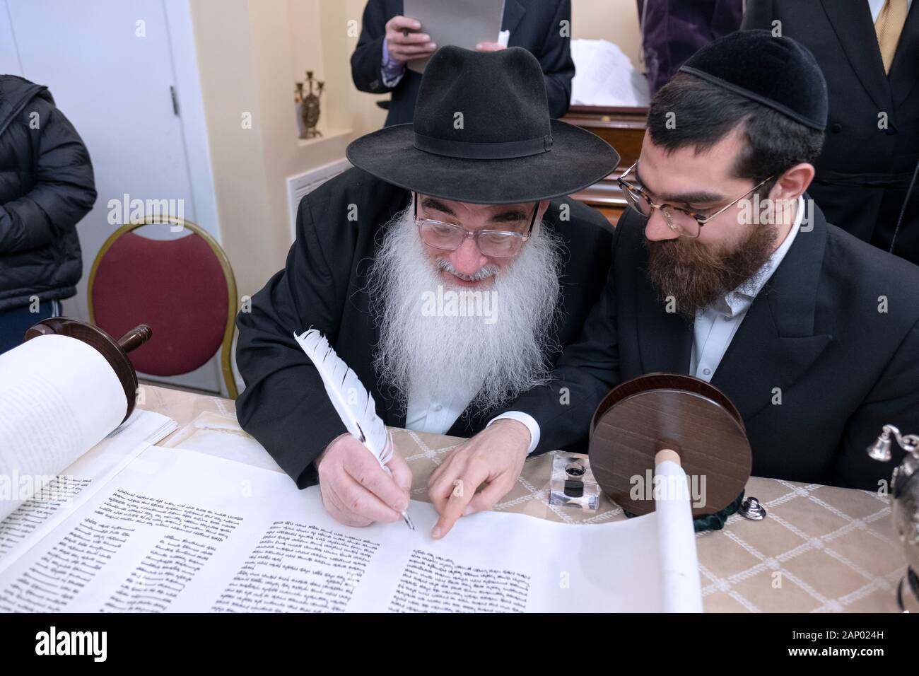 The completion of the writing of a new Torah is a communal process ...