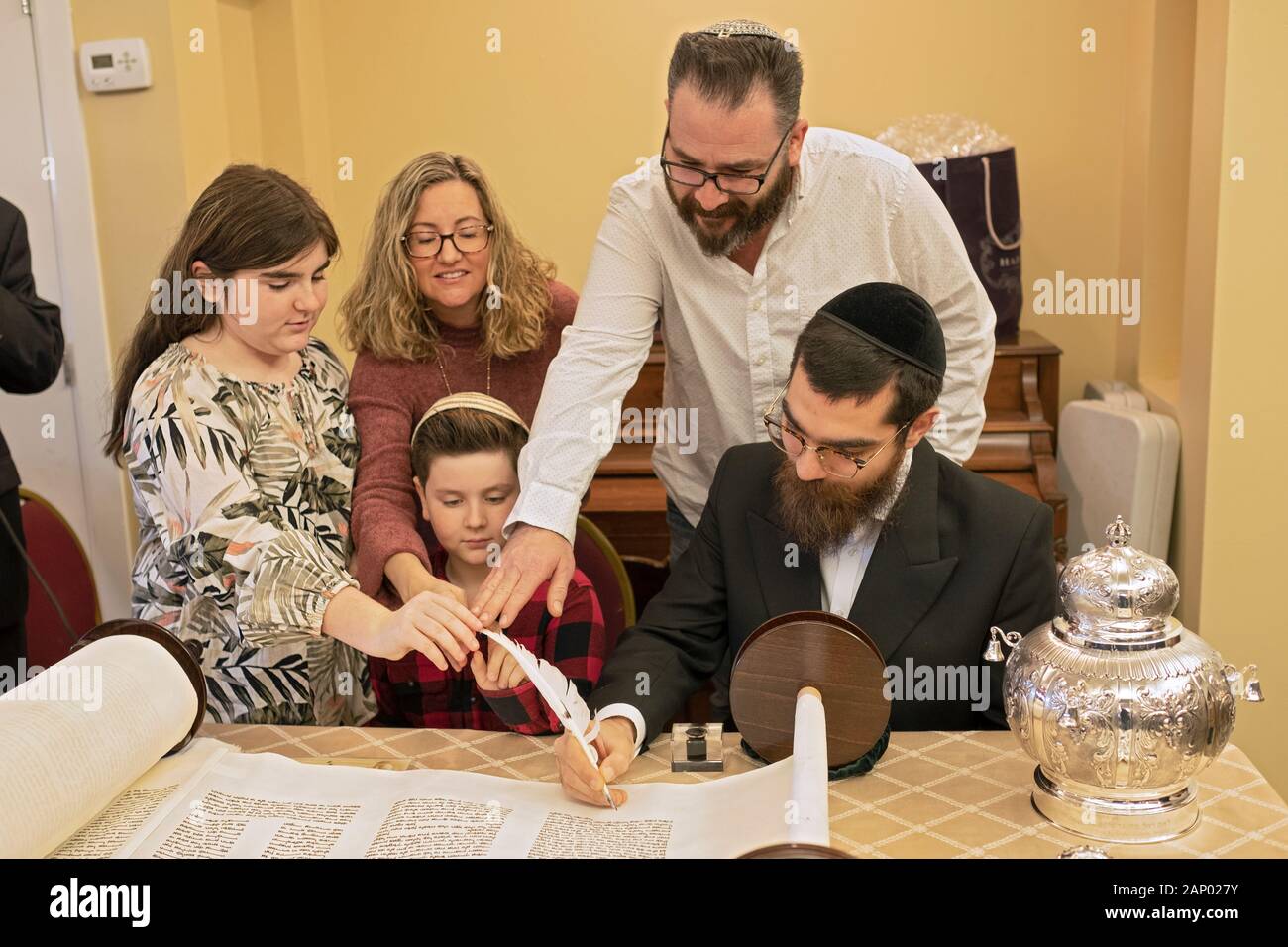 The completion of the writing of a new Torah is a communal process ...