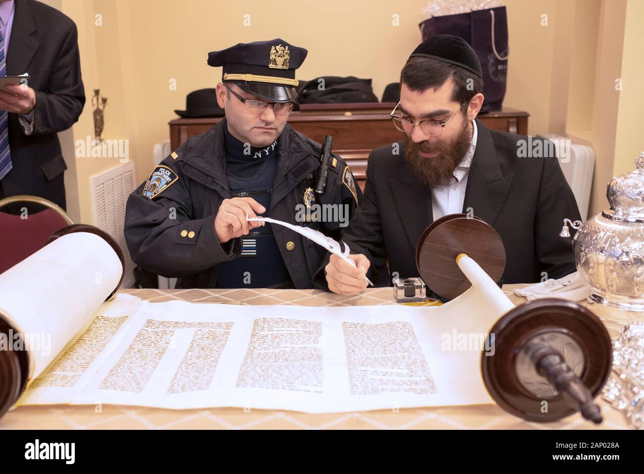 The completion of the writing of a new Torah is a communal process ...