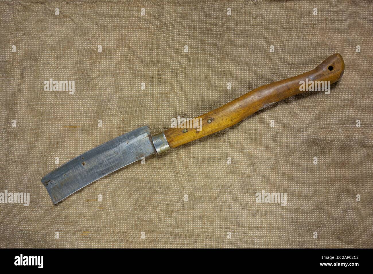 Big butcher knife on bagging fabric background. Closeup view of weapon ...