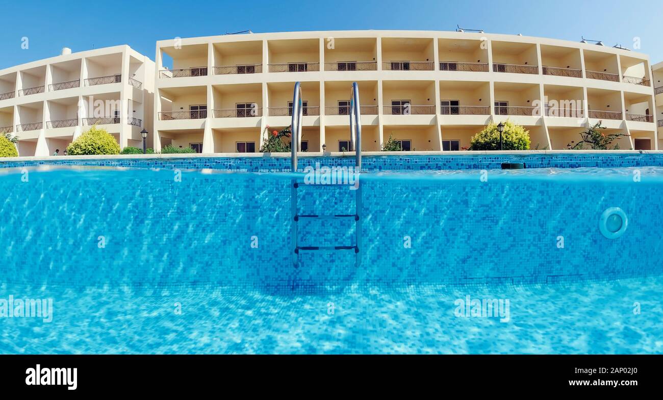 Underwater split shot photos of the hotel resort pool Stock Photo - Alamy