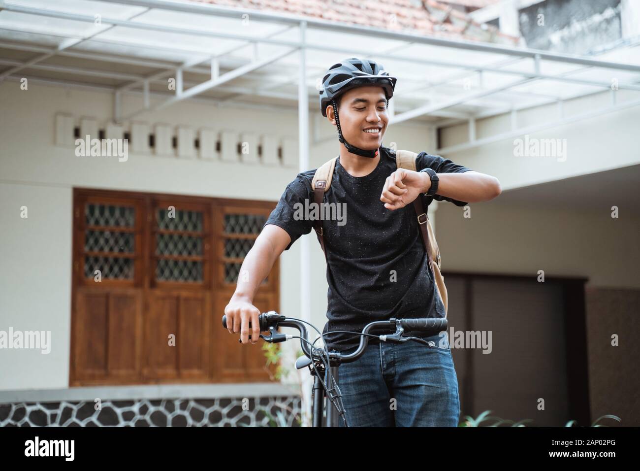 Man standing pose with cycle hi-res stock photography and images - Alamy